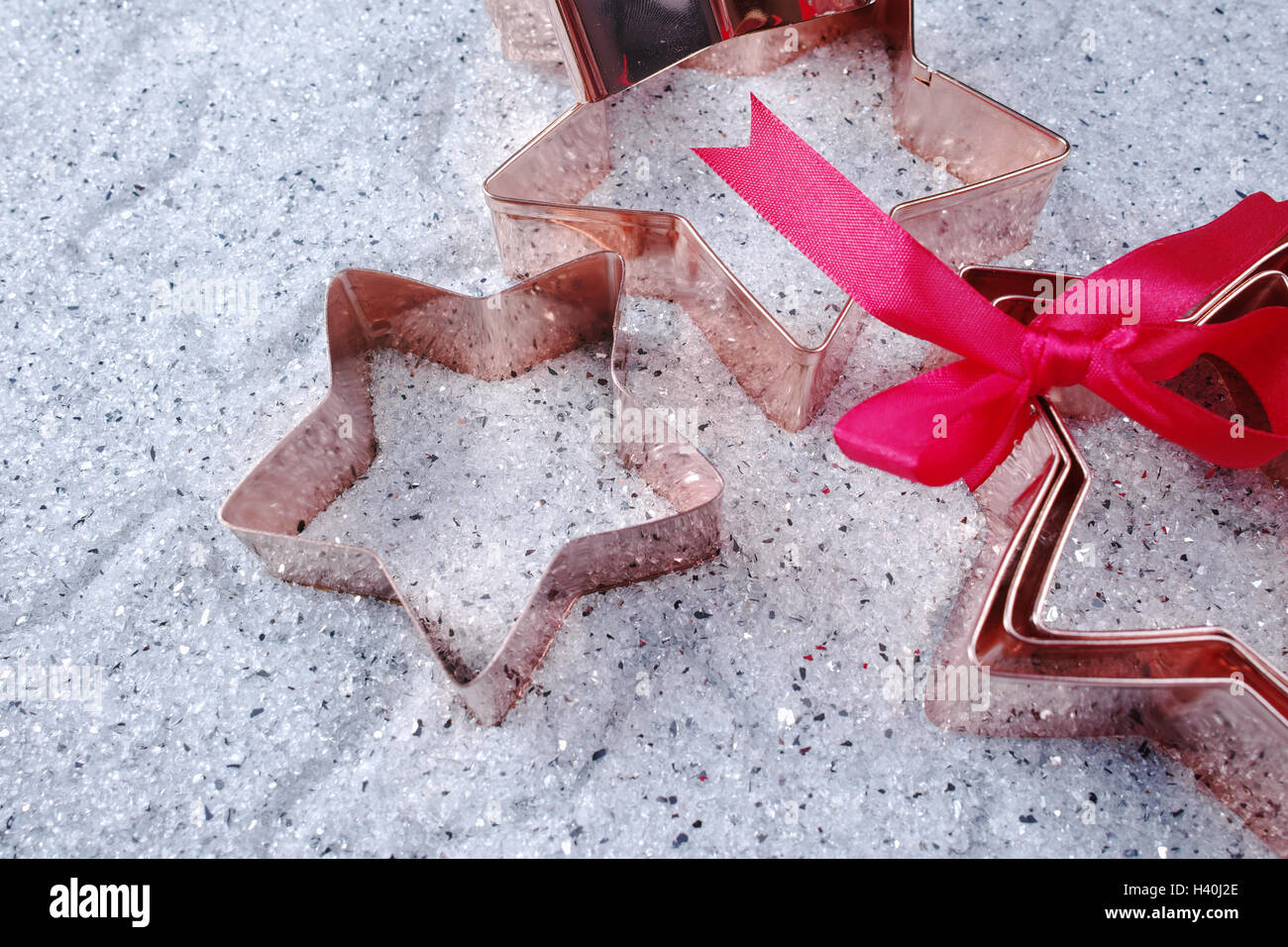 Copper star-shaped cookies cutter on shiny mirrored background Stock ...