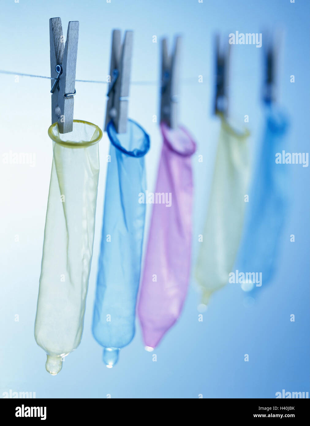 Clothesline, clamps, condoms, hang, Still life, material recording ...