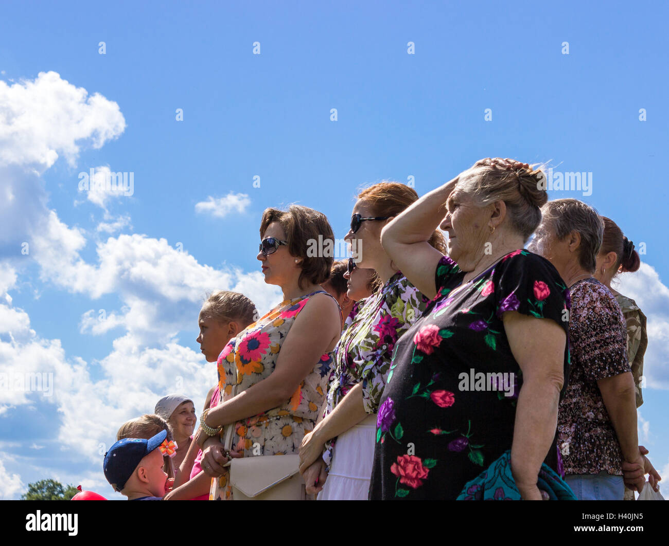 Woman on a background of blue sky Stock Photo - Alamy