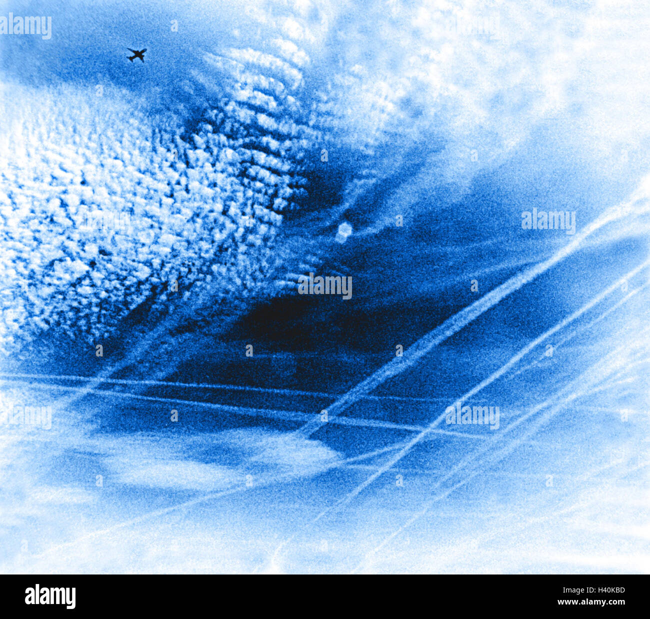 cloudy sky, airplane, condensation trail, from below, monochrome ...