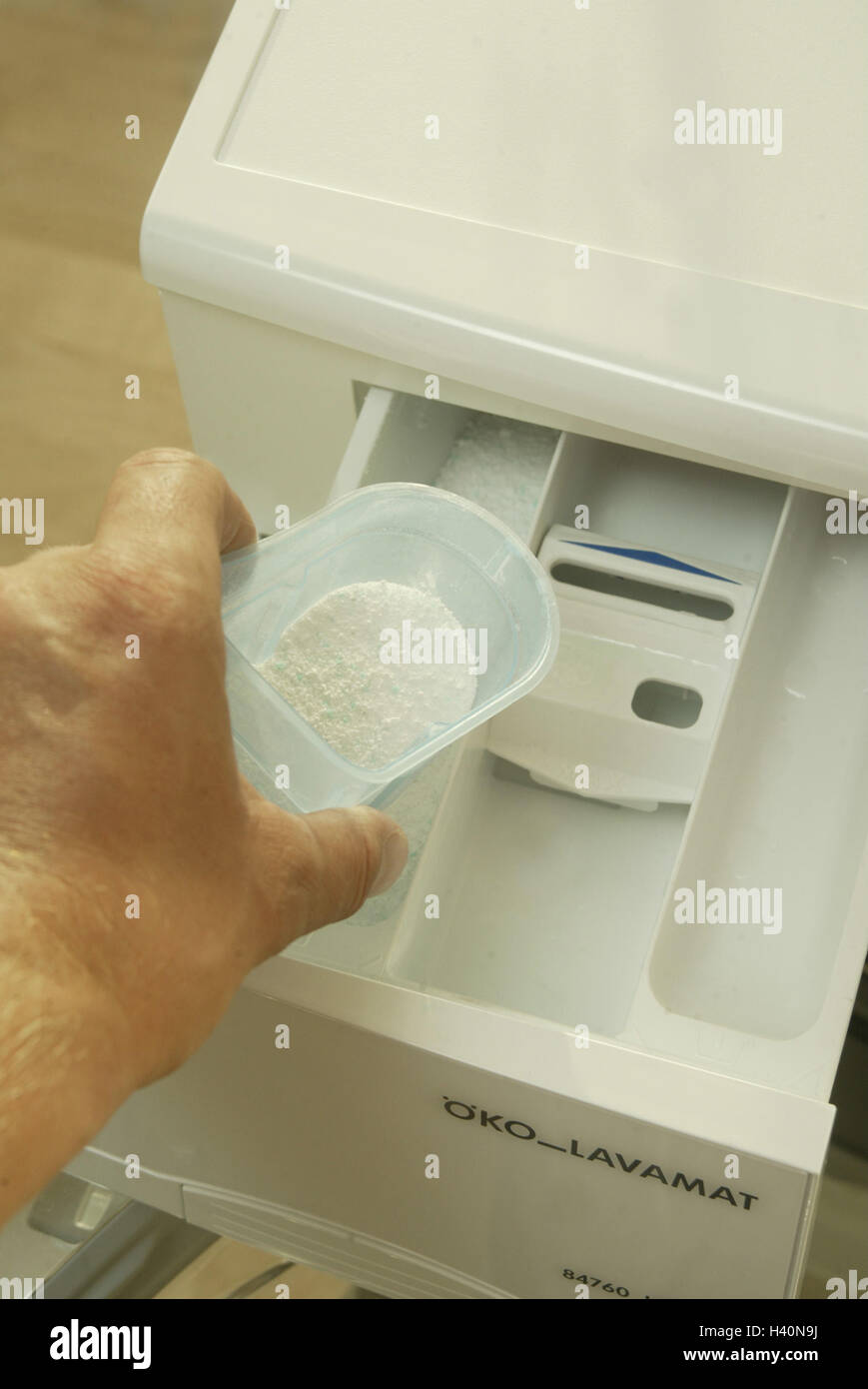 Washing machine, Dosierbehälter, man's hand, washing powder, fill ...