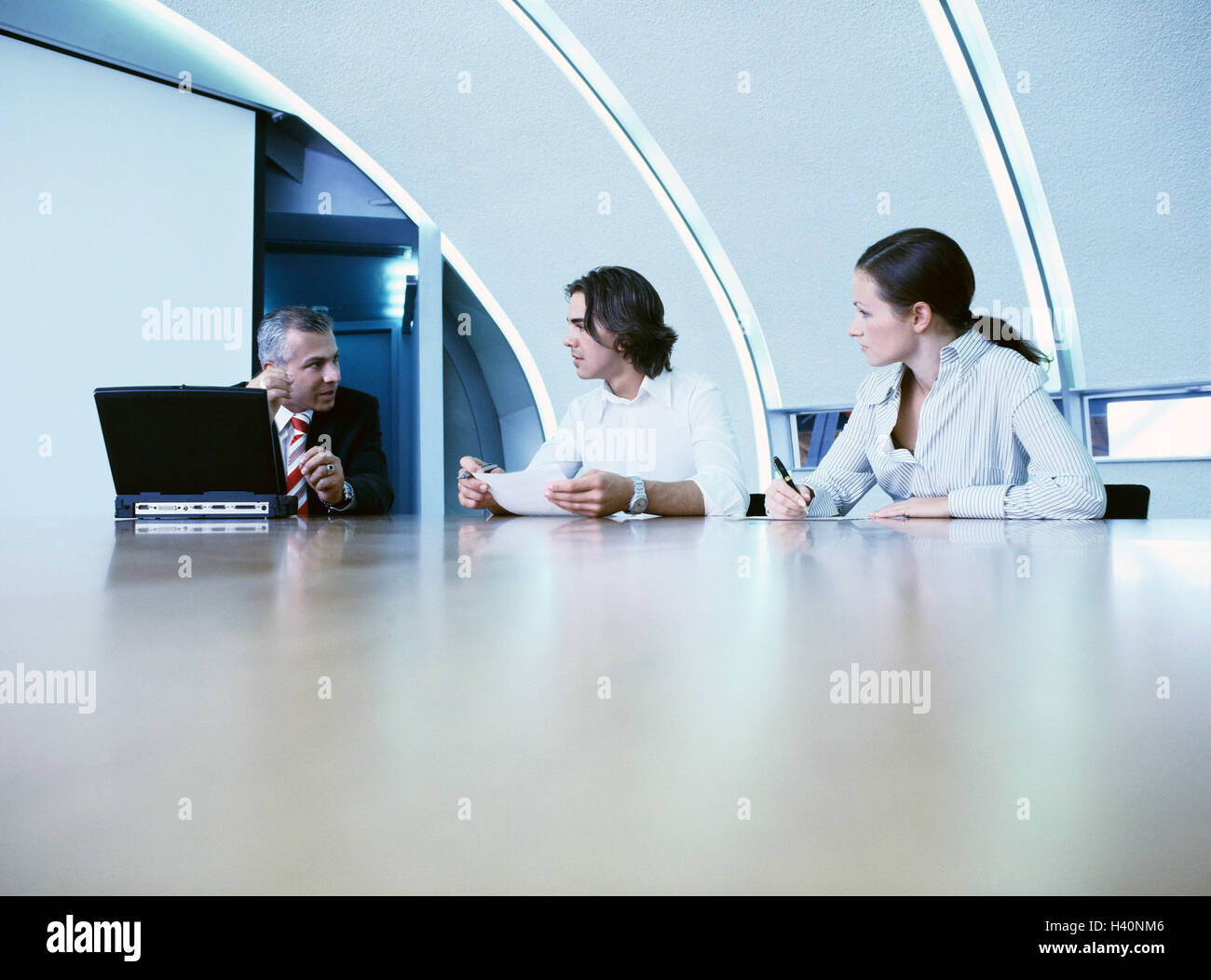 Conference room, businessman, couple, conversation Stock Photo - Alamy
