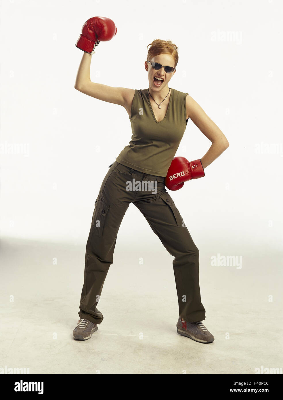 Woman, young, boxing gloves, gesture, aggressively, winner's pose ...