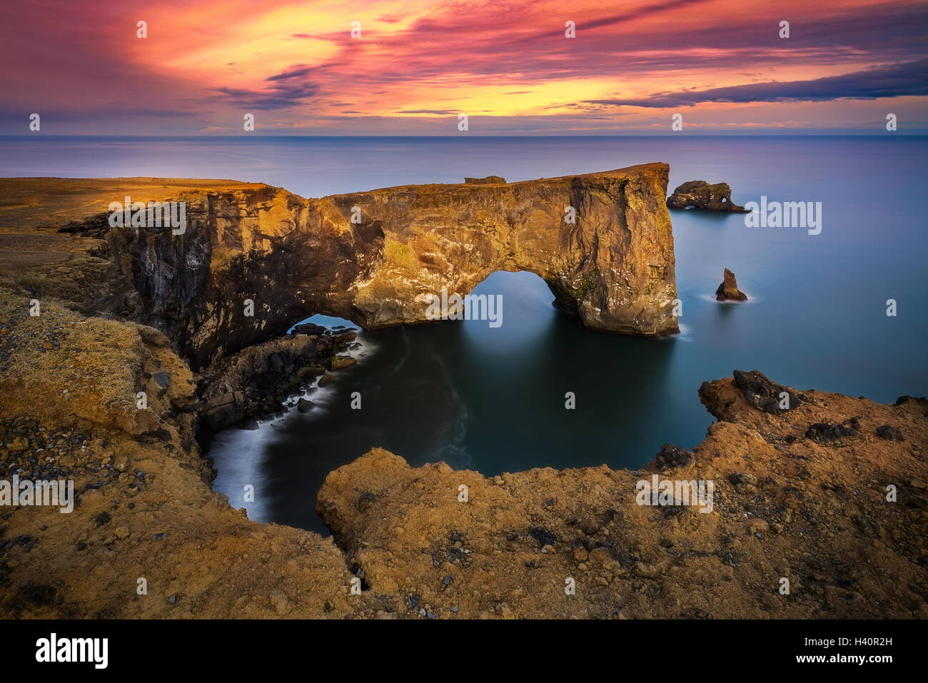 Sunset on Dyrhólaey Arch in Iceland Stock Photo - Alamy