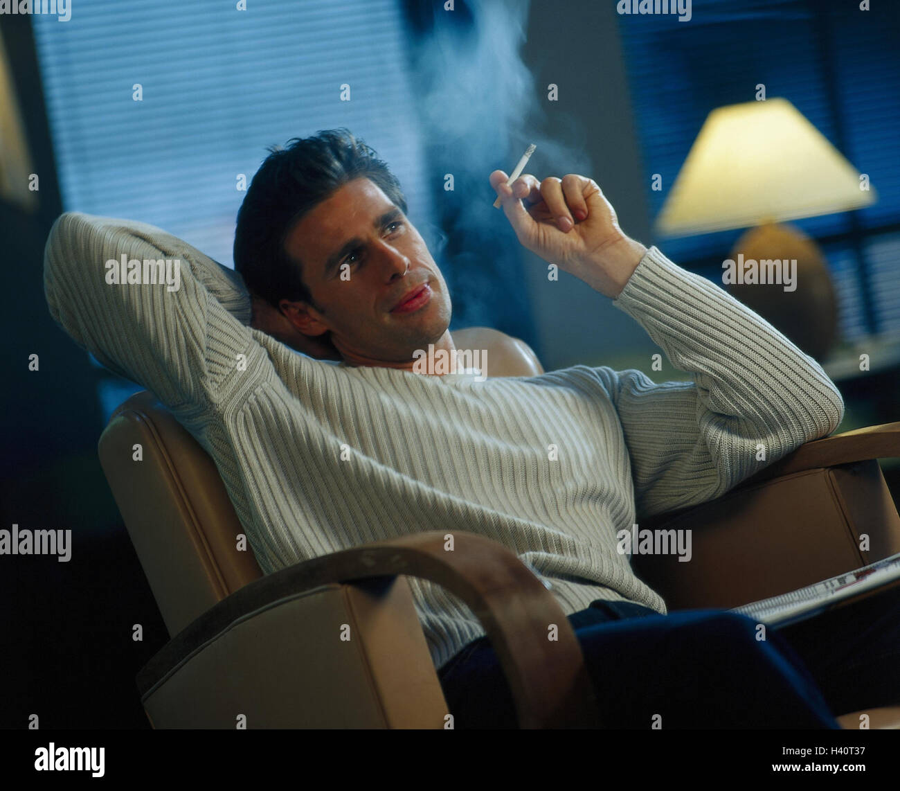 Man armchair smoke recreation hi-res stock photography and images - Alamy