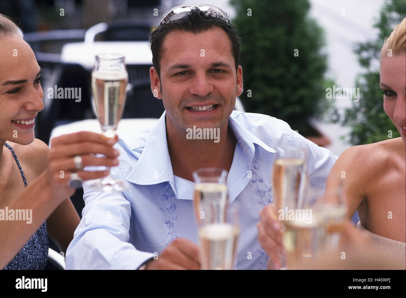 Street bar, man, women, Sparkling Wine, raise the glass, outside ...