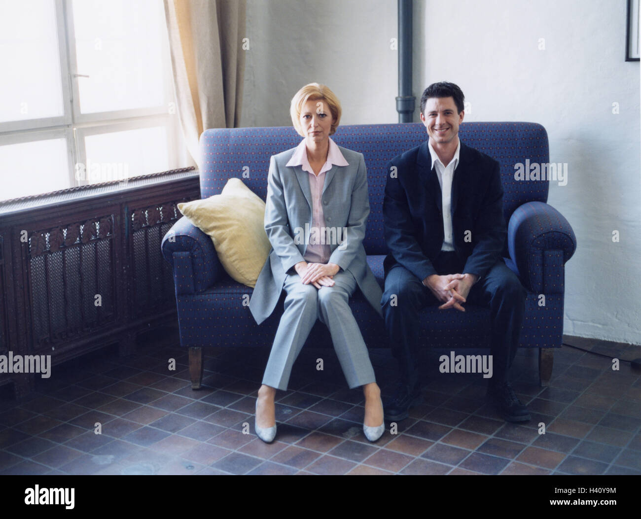 Entrance hall, sofa, couple, sit, smile seriously, waiting rooms, 30 ...