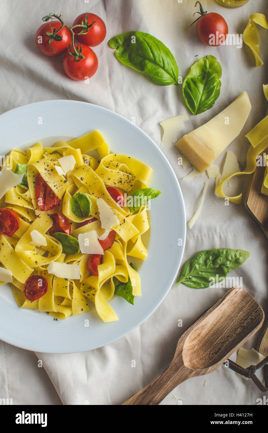 Tagliatelle in Italian colors, roasted tomatoes, basil and Parmesan ...