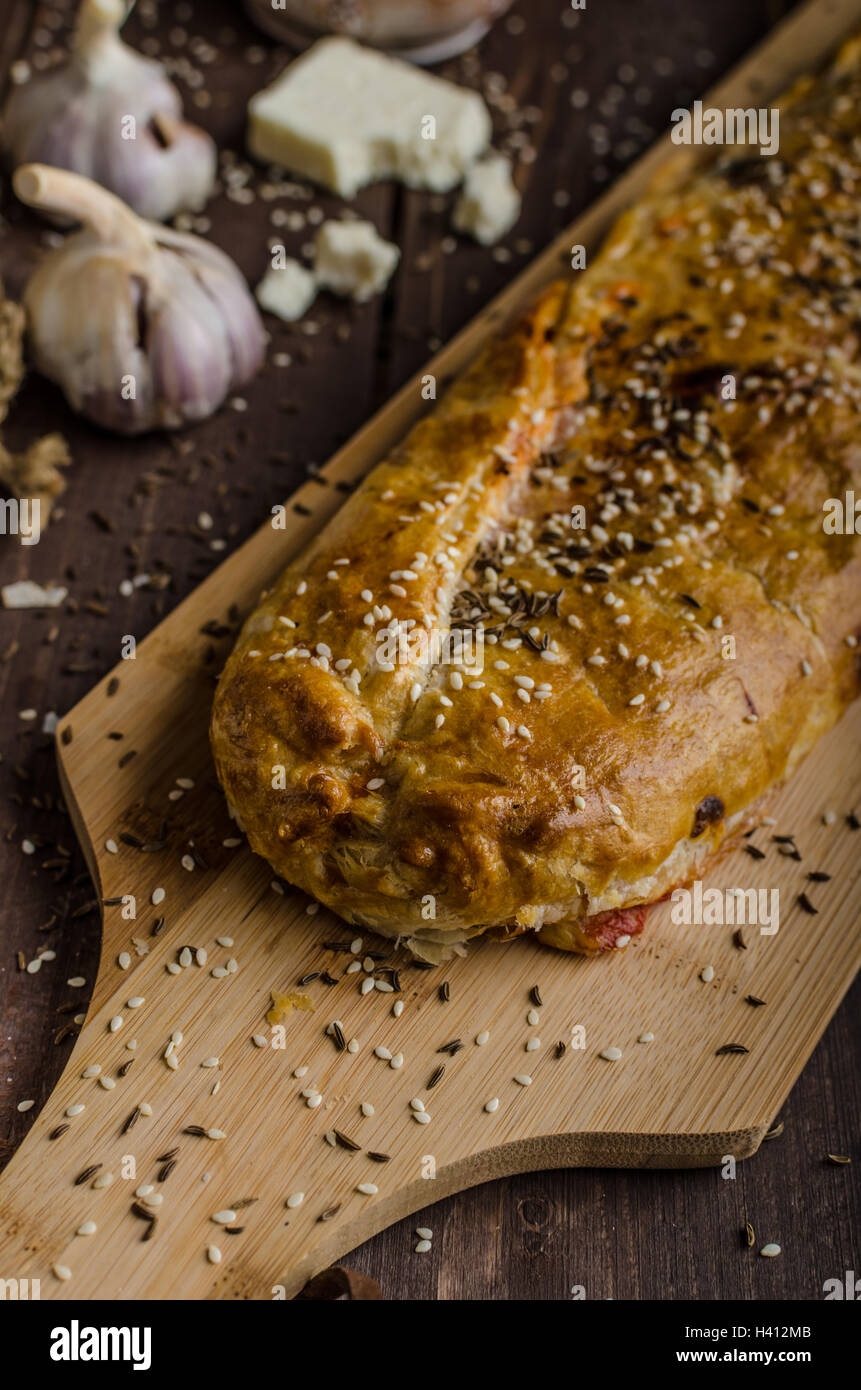 Savory strudel with ham, cheese and garlic Stock Photo - Alamy