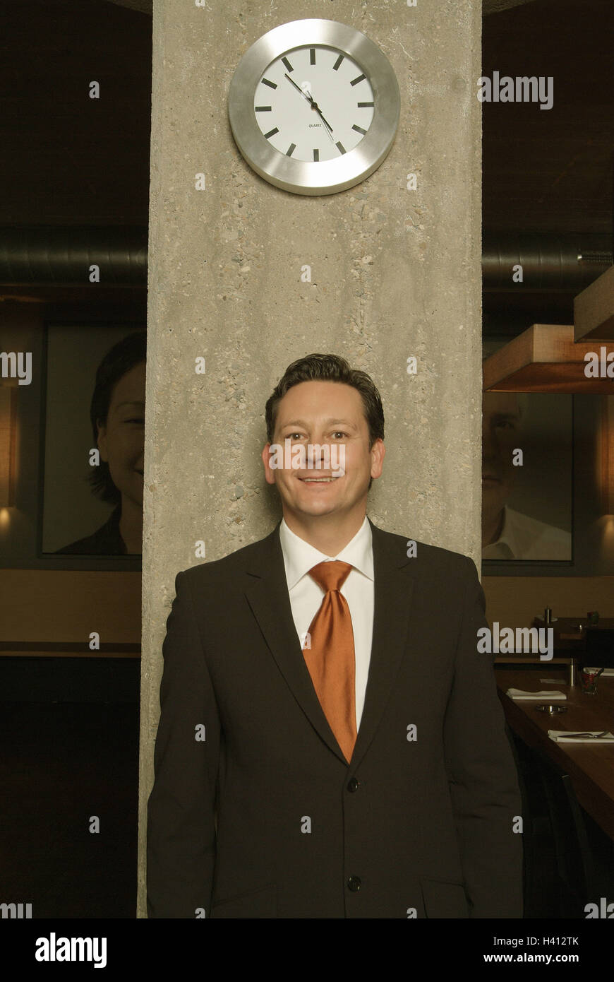 Hall, pillar, wall clock, businessman, stand, wait, smile, half ...