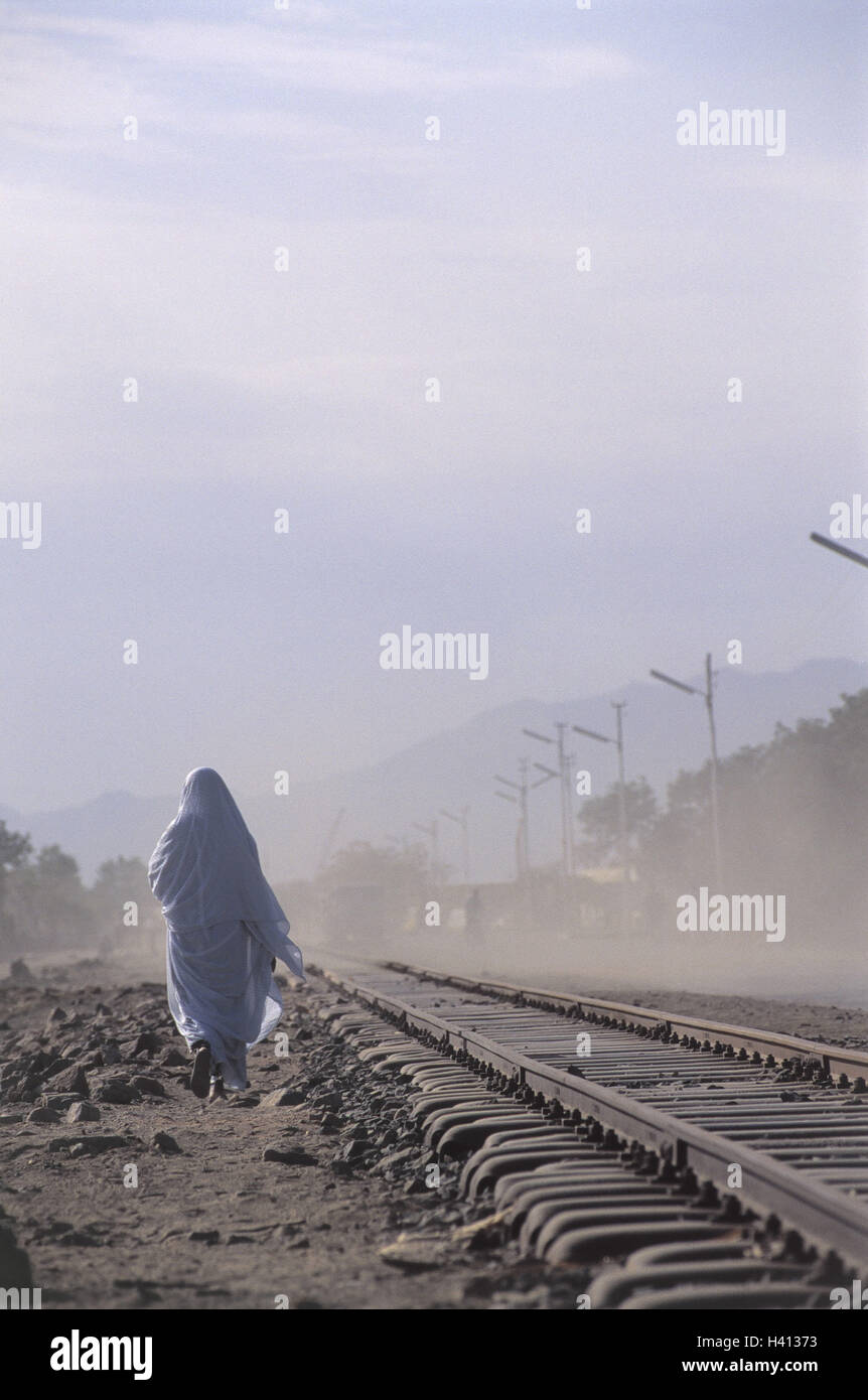 Eritrea, Massaua, railroad tracks, woman, back view, Sand attack ...