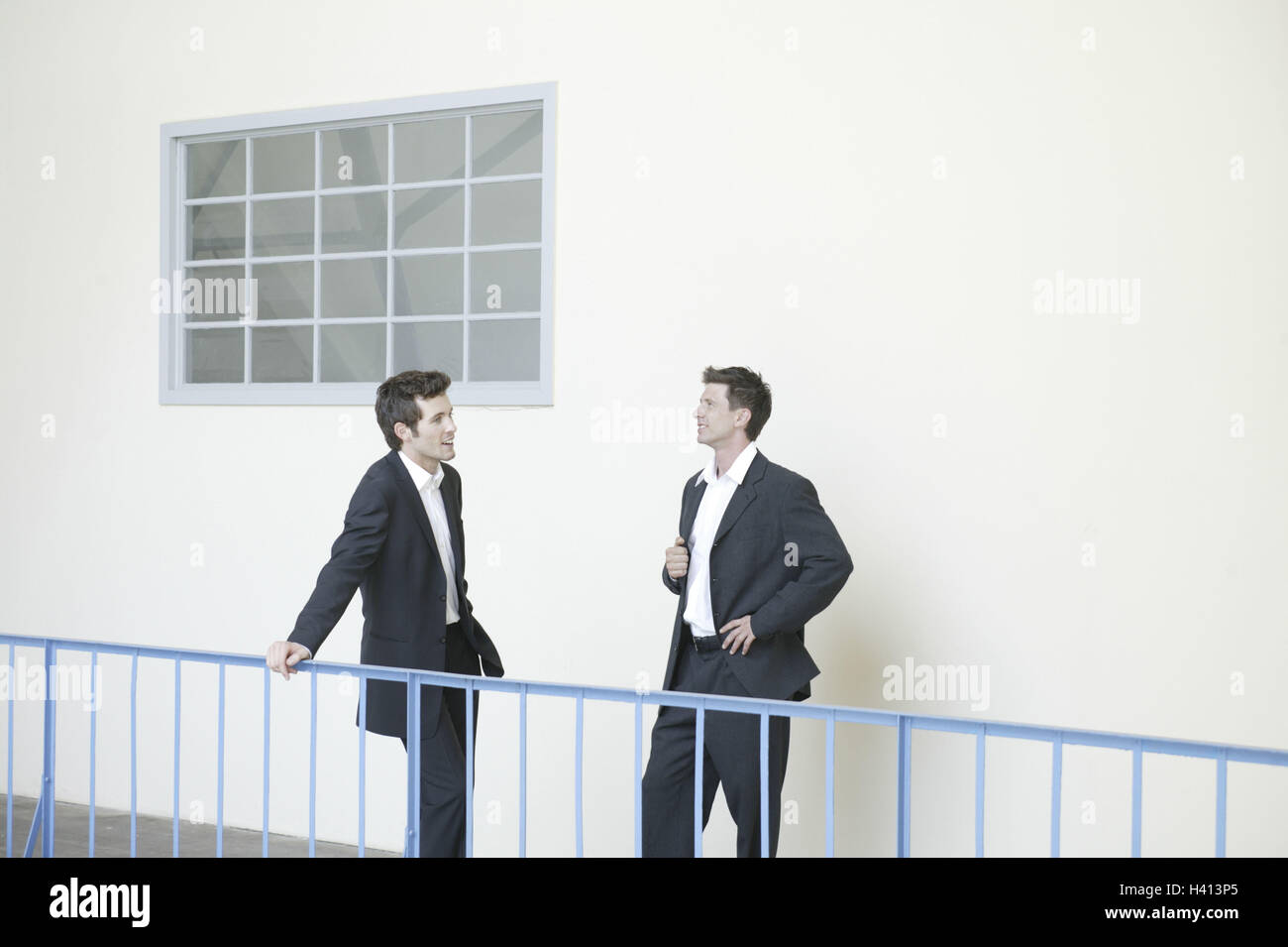 Office buildings, hall, manager, conversation, eye contact Stock Photo ...