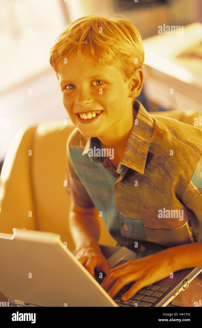 Sofa, boy, smile, play laptop, data entry, portrait, child, 6 - 12 ...
