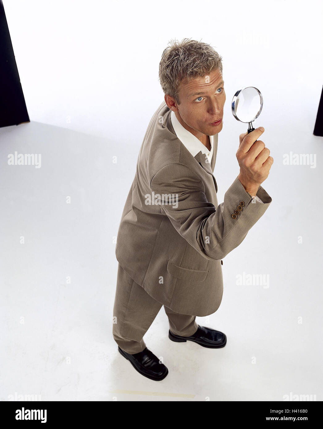 Man young suit loupe hi-res stock photography and images - Alamy
