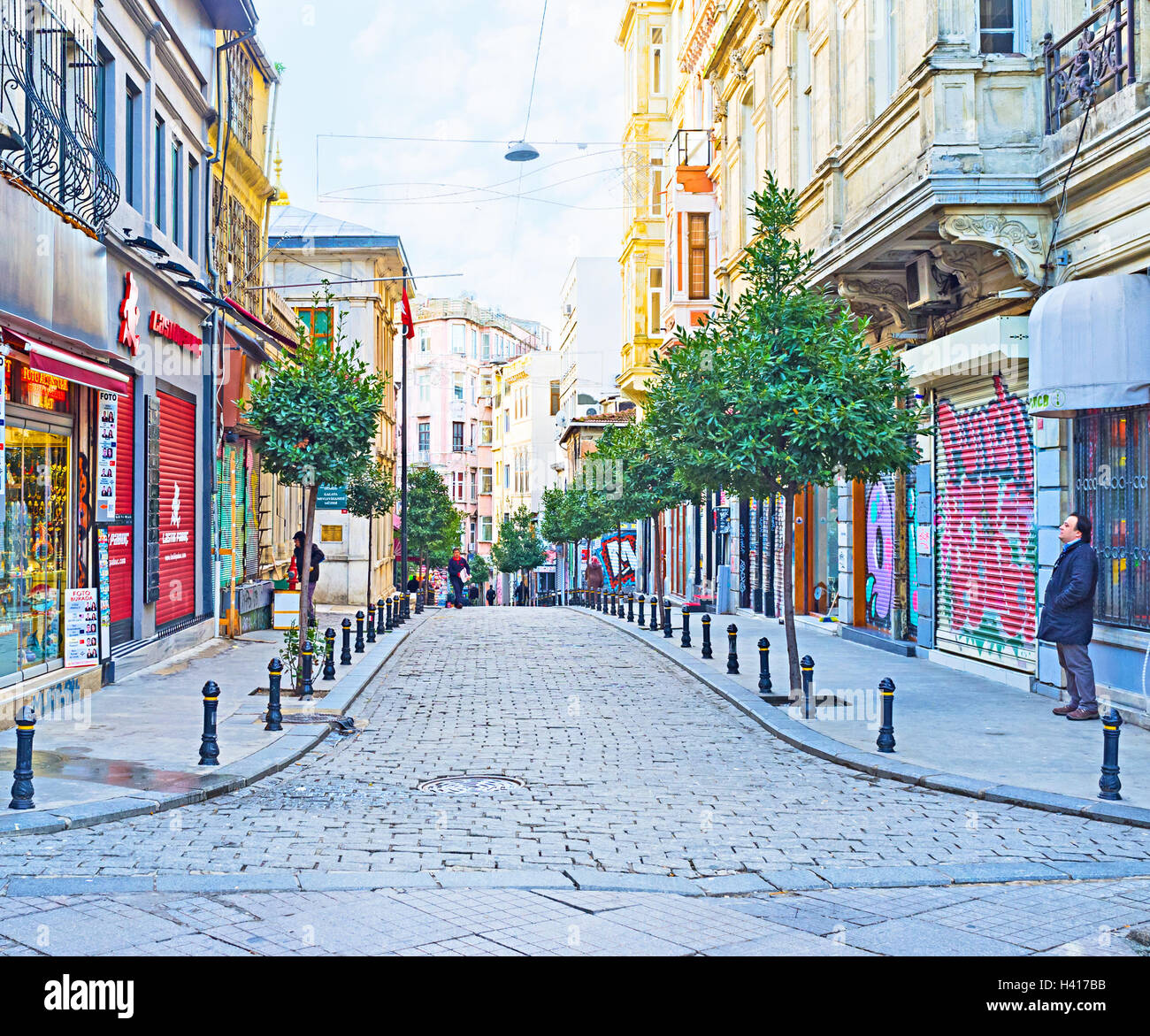 The old neighborhood in Beyoglu district with many stores and art ...