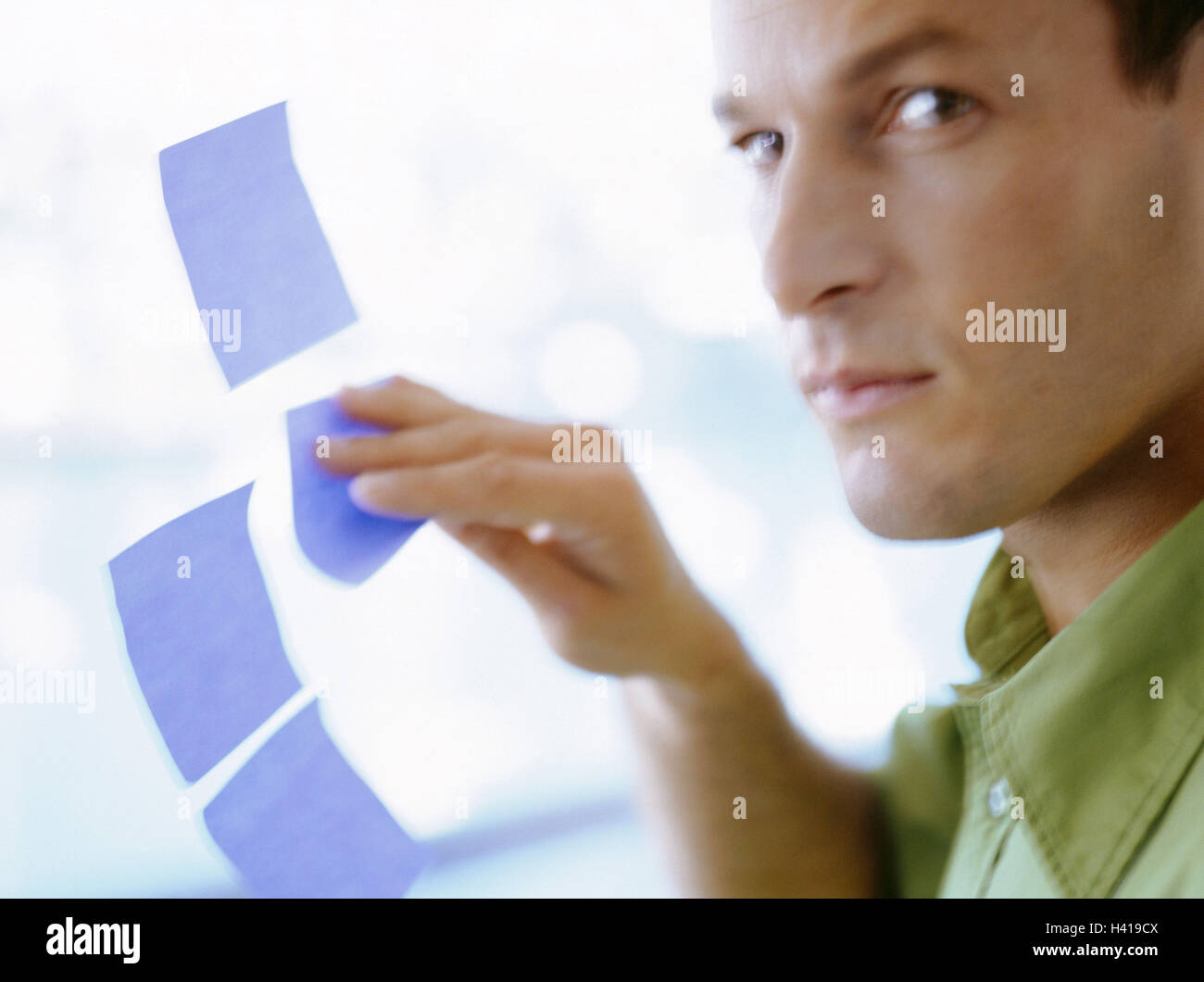Office worker, windowpane, note slips paper, view camera, seriously ...