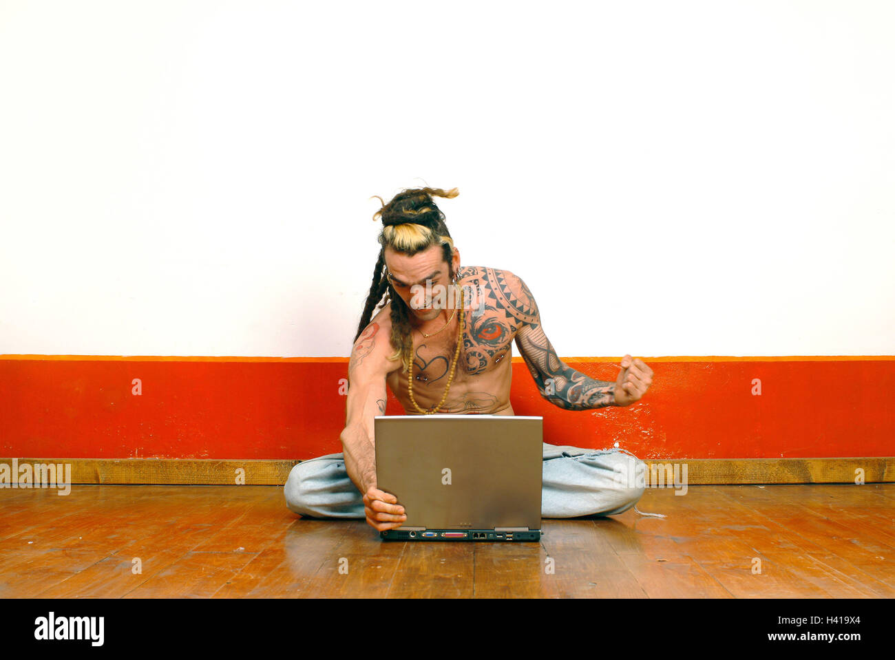 Man, young, dreadlocks, free upper part of the body, tattoos, notebook ...