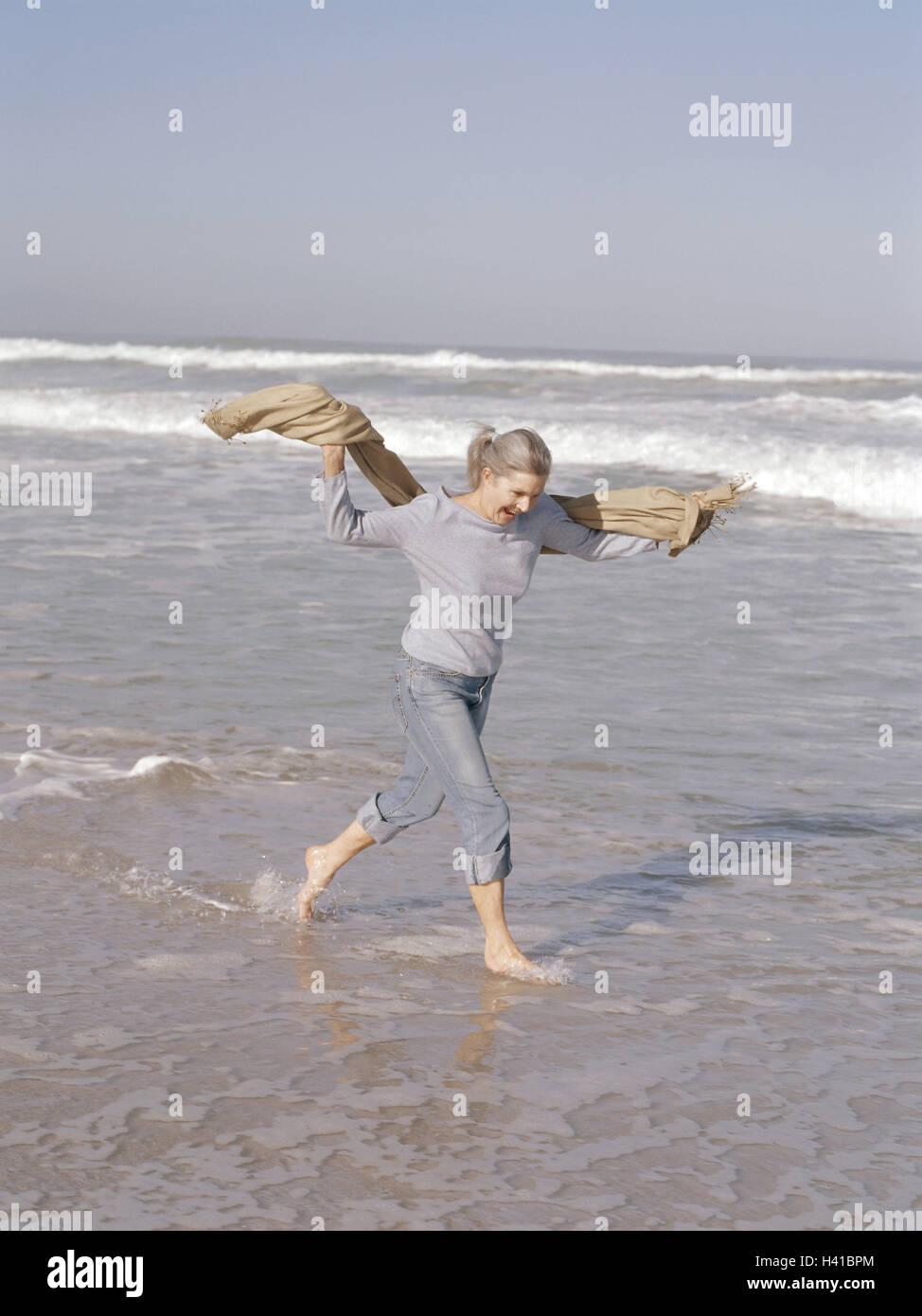 Sandy beach, sea, senior, happy, water shallowly, run, enjoy side view ...