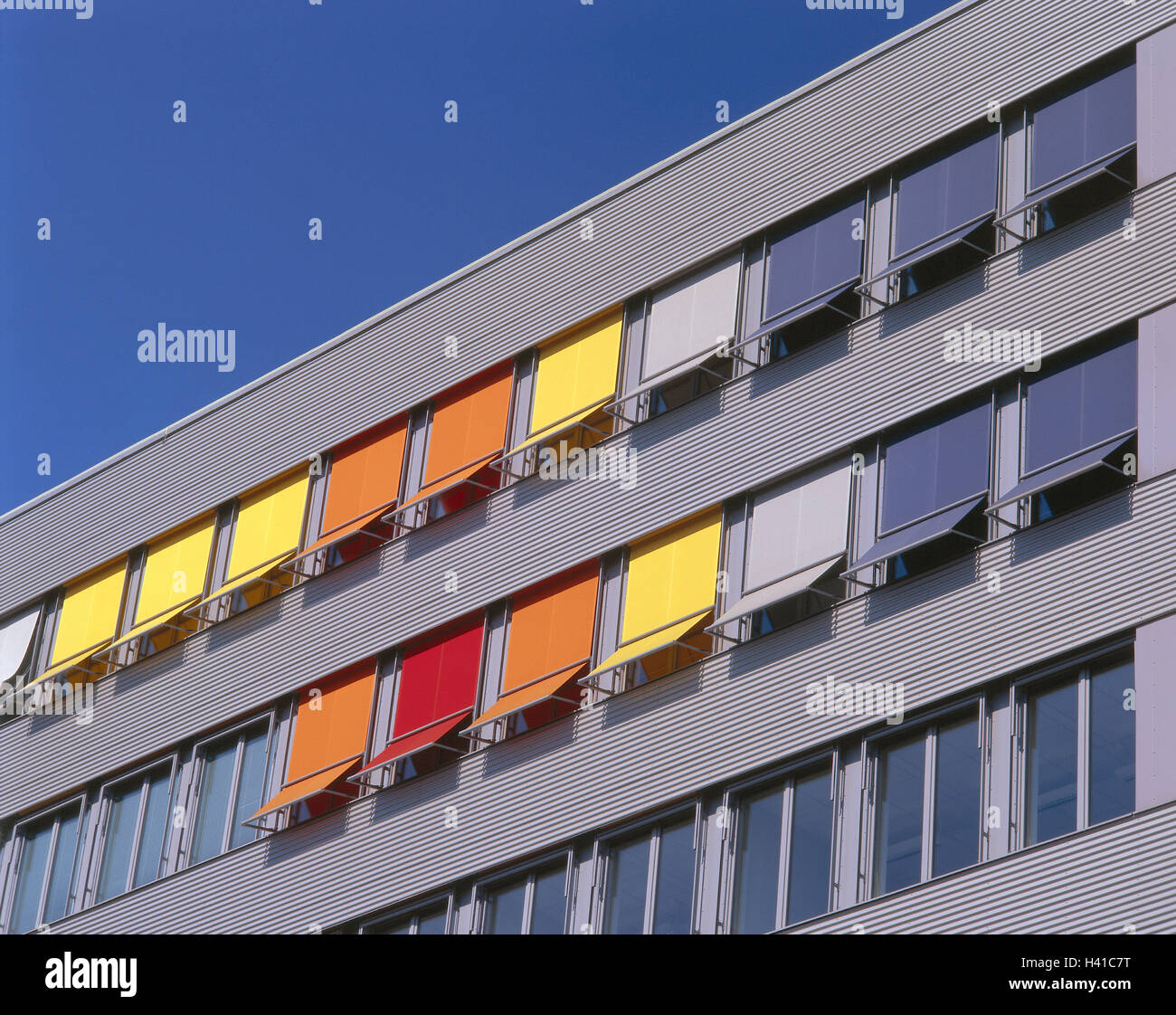 Germany, Bavaria, Munich, high rise facade, awnings, colourfully ...