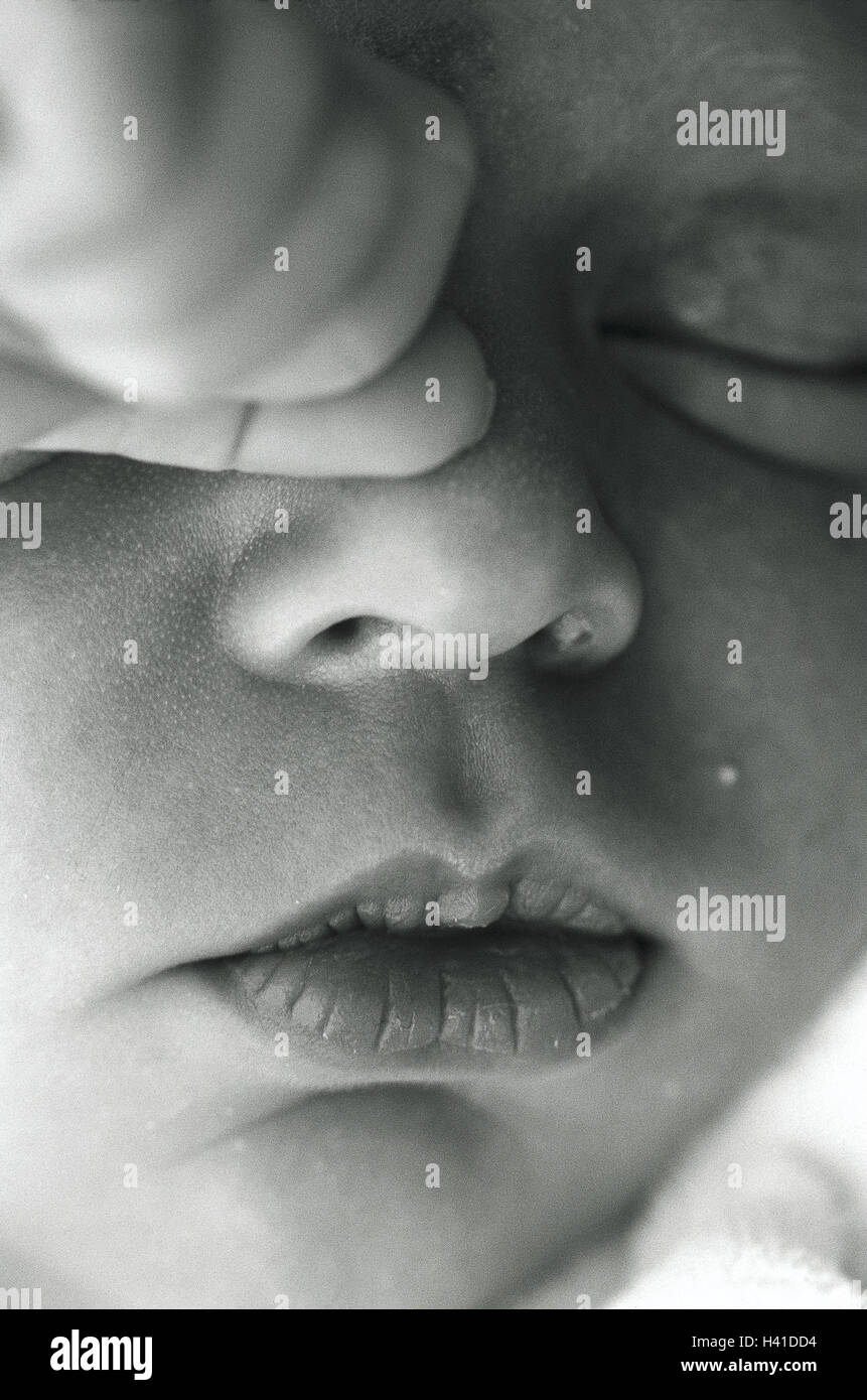 Baby, wearily, hand face close-up, b/w Stock Photo - Alamy