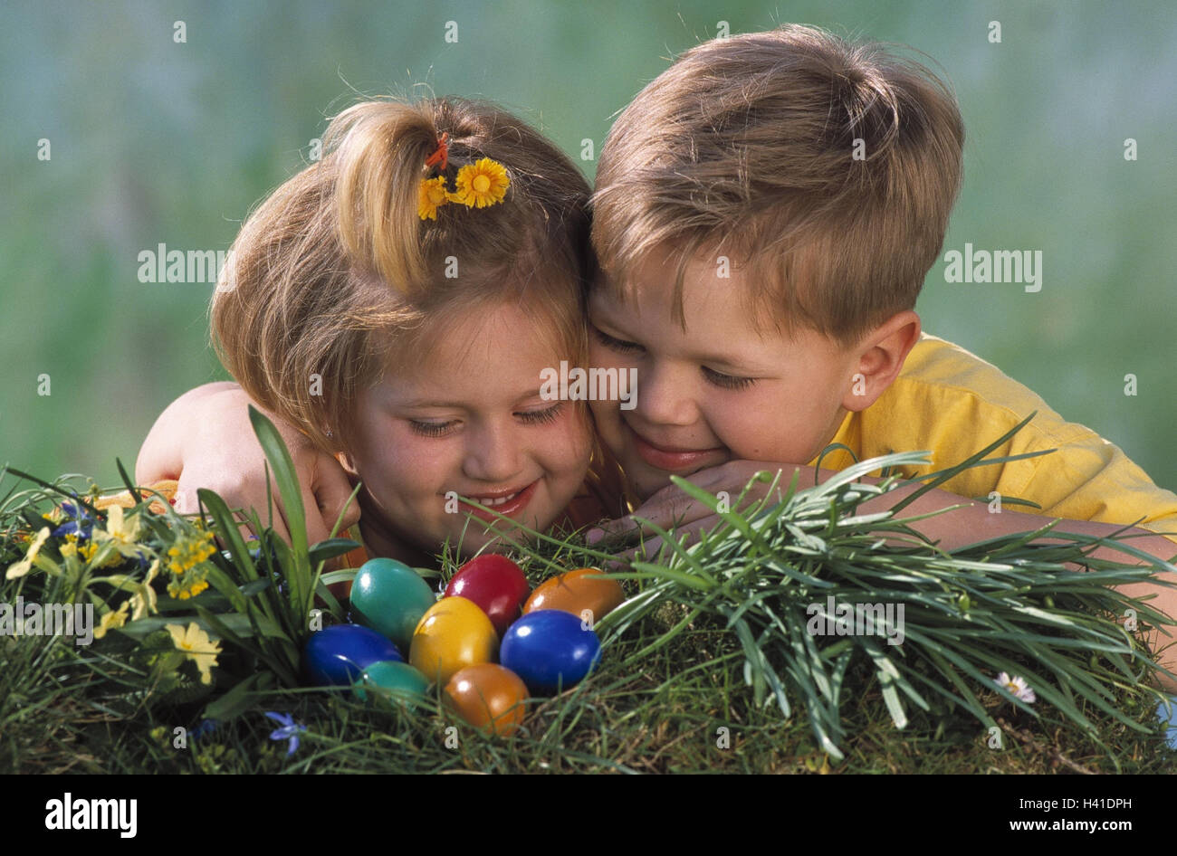 Meadow, boy, girl, lie, hide Easter nest, portrait, model released ...
