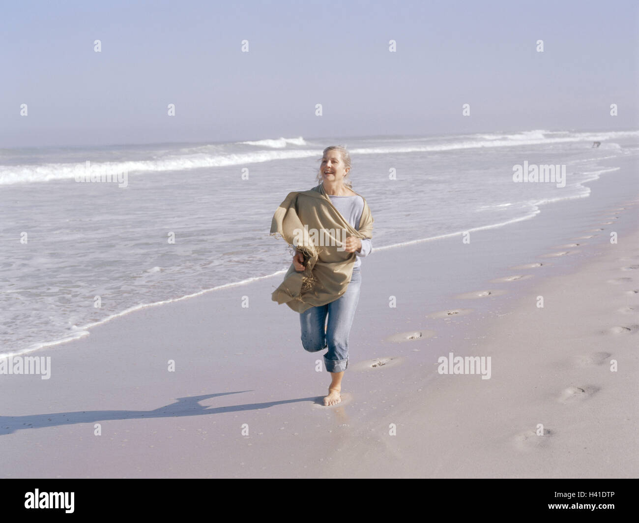 Sandy beach, sea, senior, happy, walk Stock Photo - Alamy
