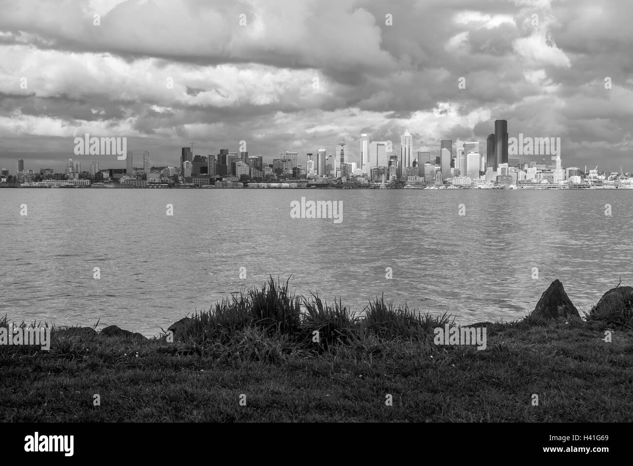 Billowing clouds hover over the Seattle skyline. Black and white image ...