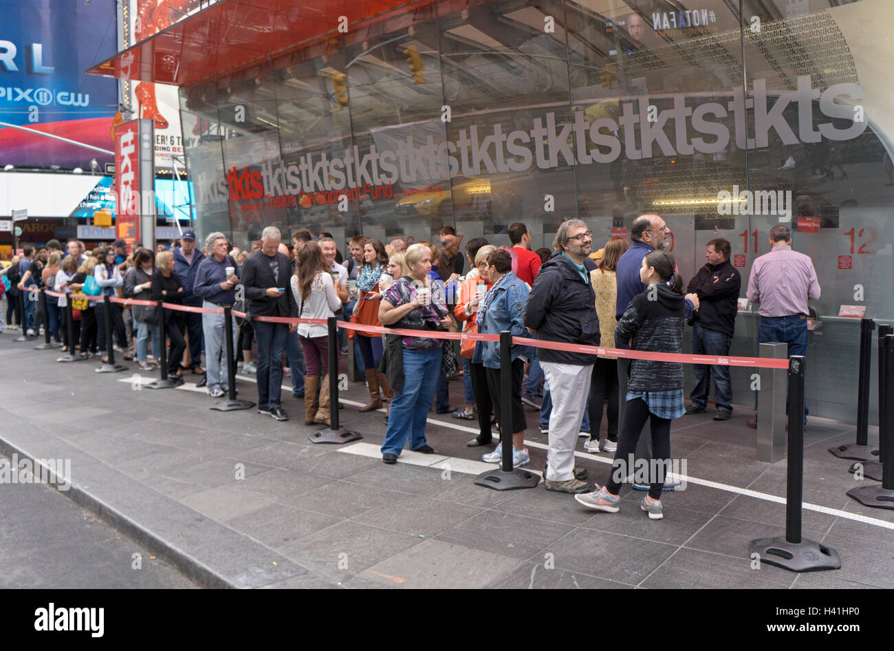 A long line of people at the TKTS window lining up for discounted ...