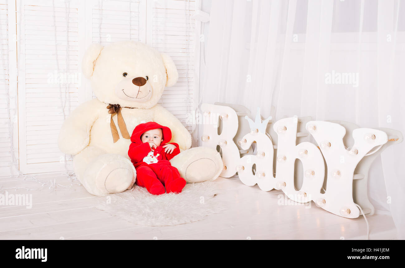 Cute baby with teddy bear Stock Photo - Alamy
