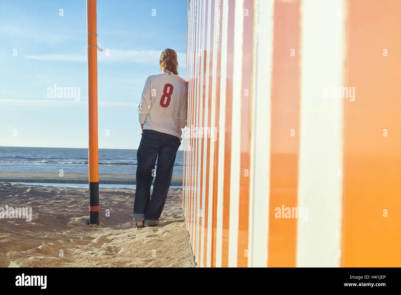 Sandy beach, beach house, woman, lean, back view, sea view, beach, Sand ...