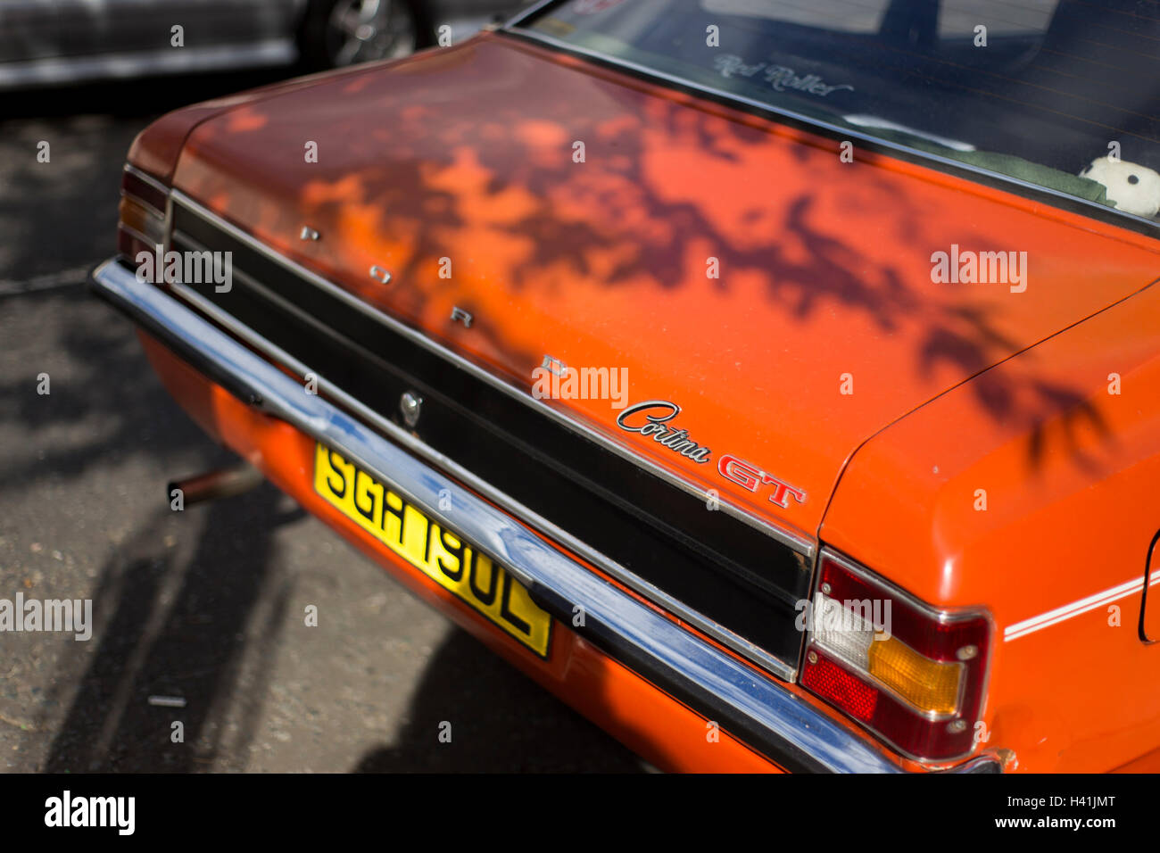 Detail of rear of bright orange Ford Cortina Stock Photo - Alamy