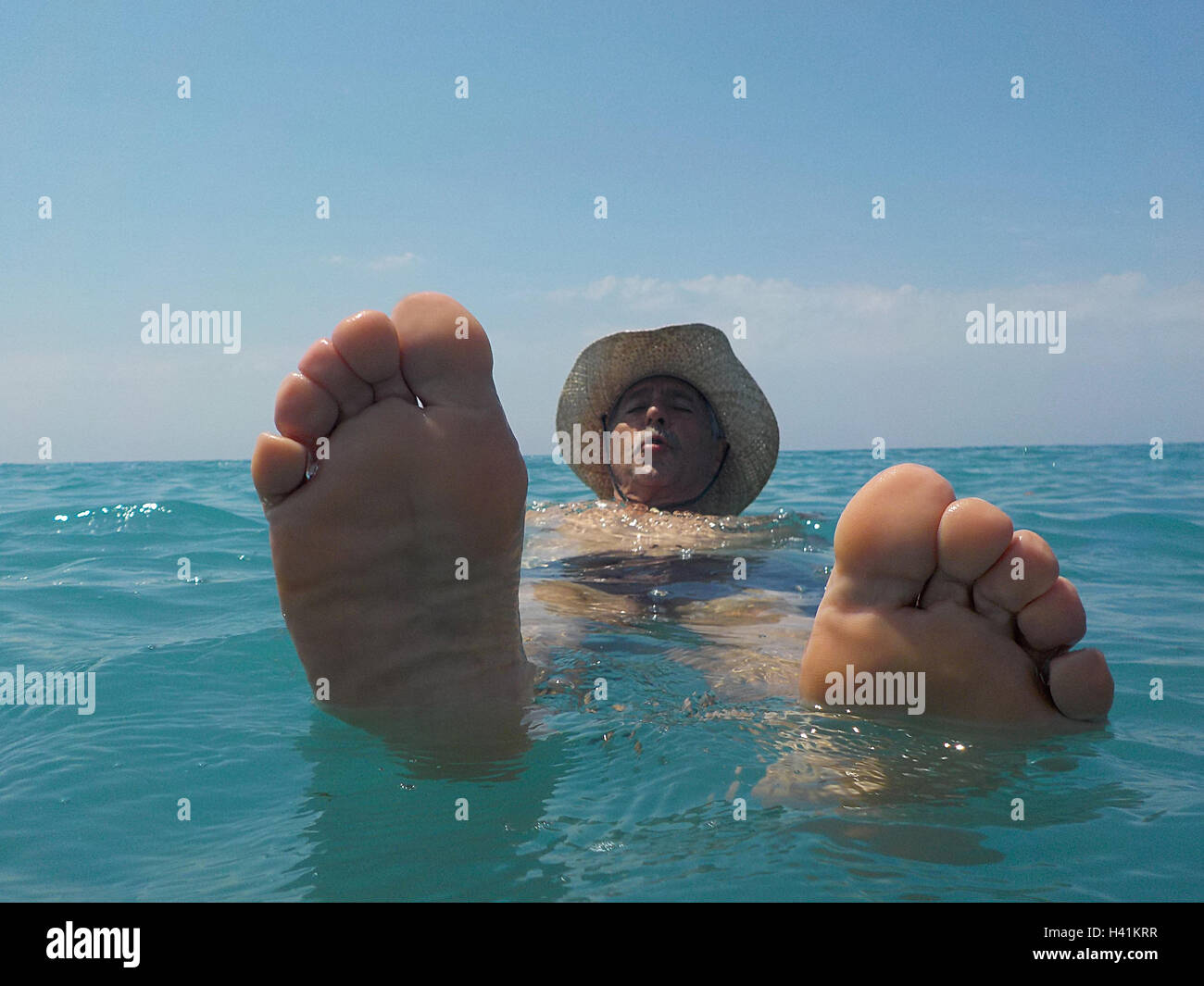 Man floating in sea Stock Photo - Alamy
