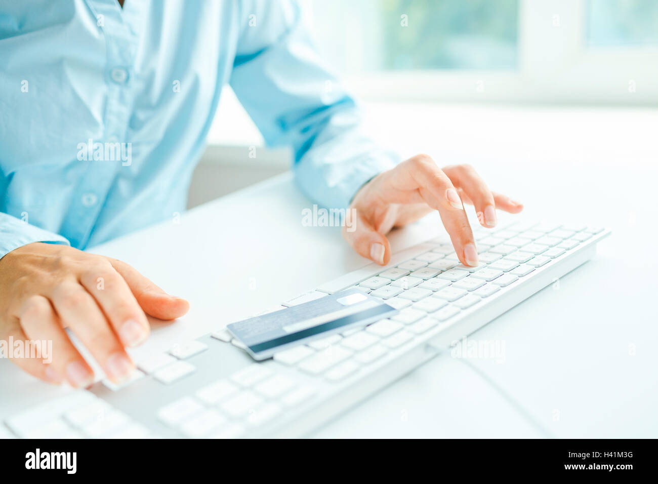 Hands using computer and credit card on it. Online shopping concept ...