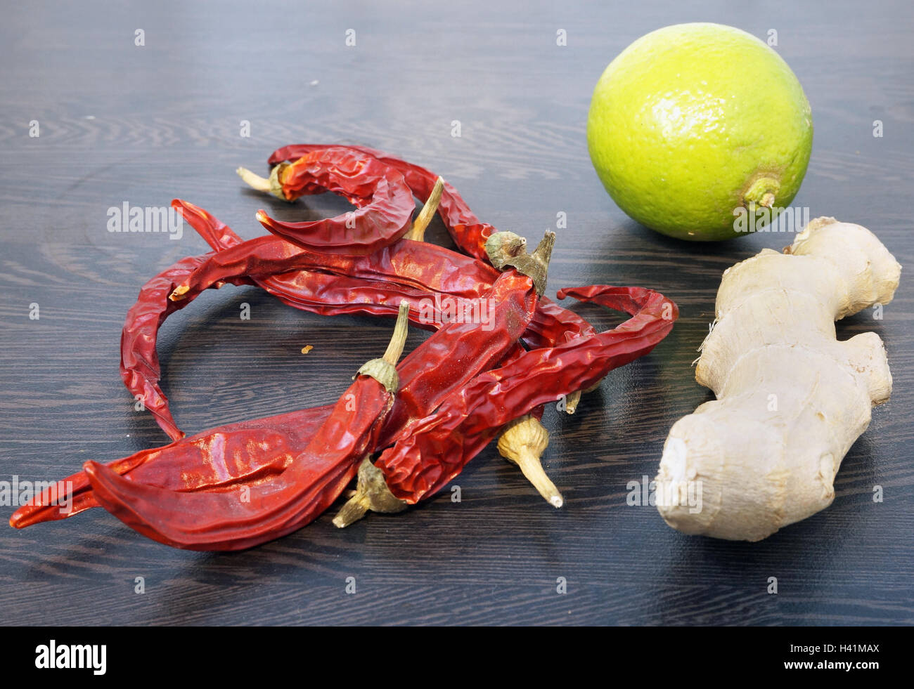 Chilli, lime and ginger. Kitchen spices on a black background Stock ...