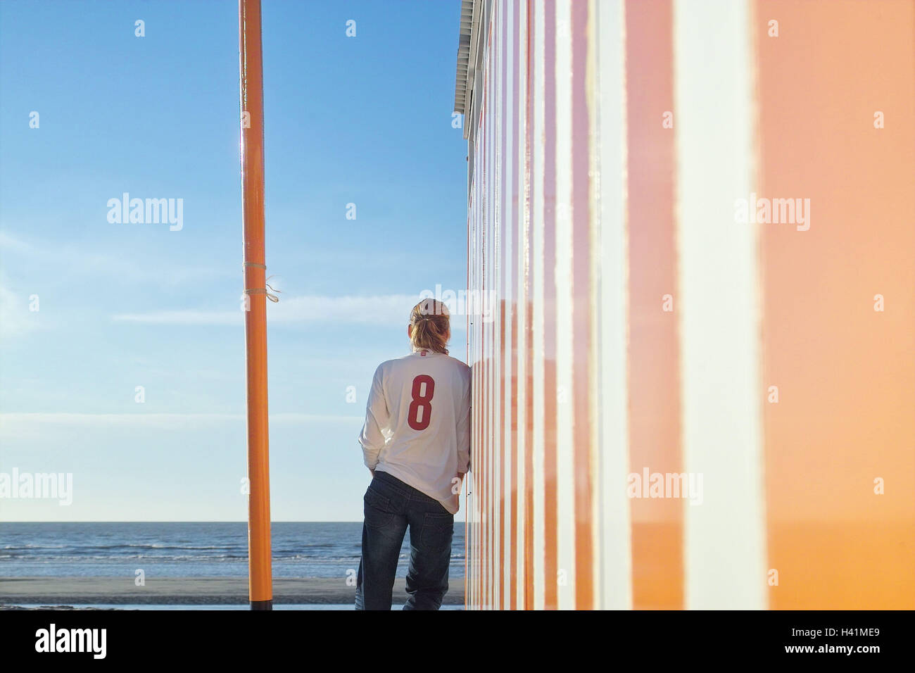 Sandy beach, beach house, woman, lean, back view, sea view, beach, Sand ...