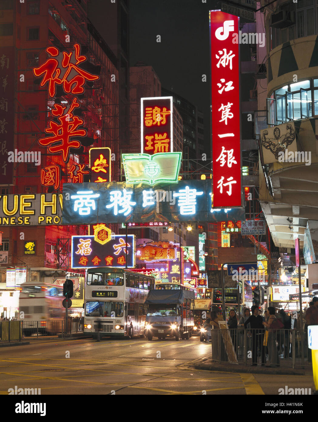 China, Hong Kong, Tsim Sha Tsui, business street, bus terminal, neon lights, evening, Asia ...