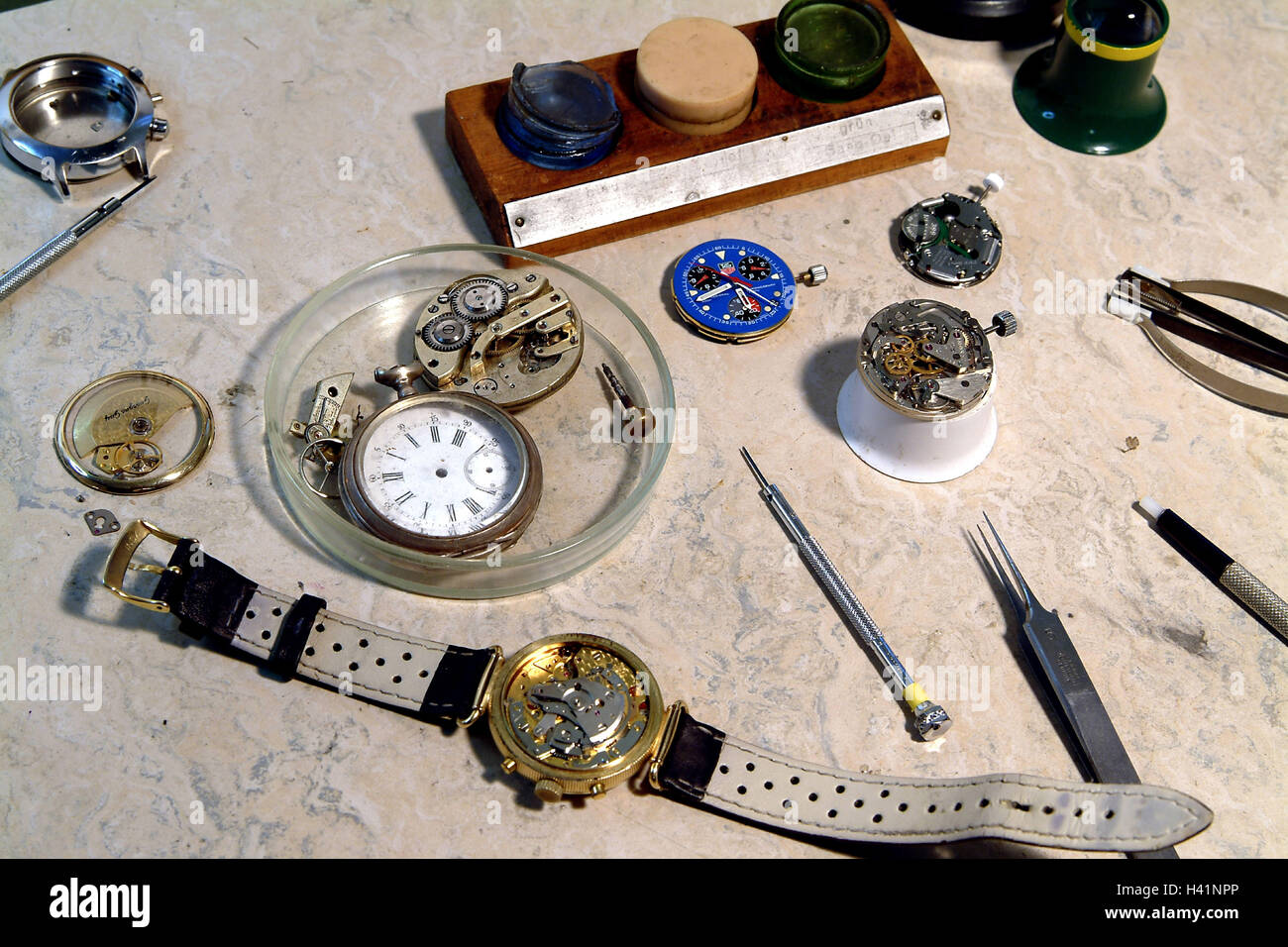 Watchmaker's garage, work surface, clocks, auseinandergebaut, tools ...