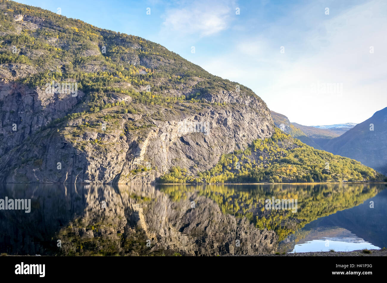perfect reflection of mountains in clear fjord landscape Stock Photo ...