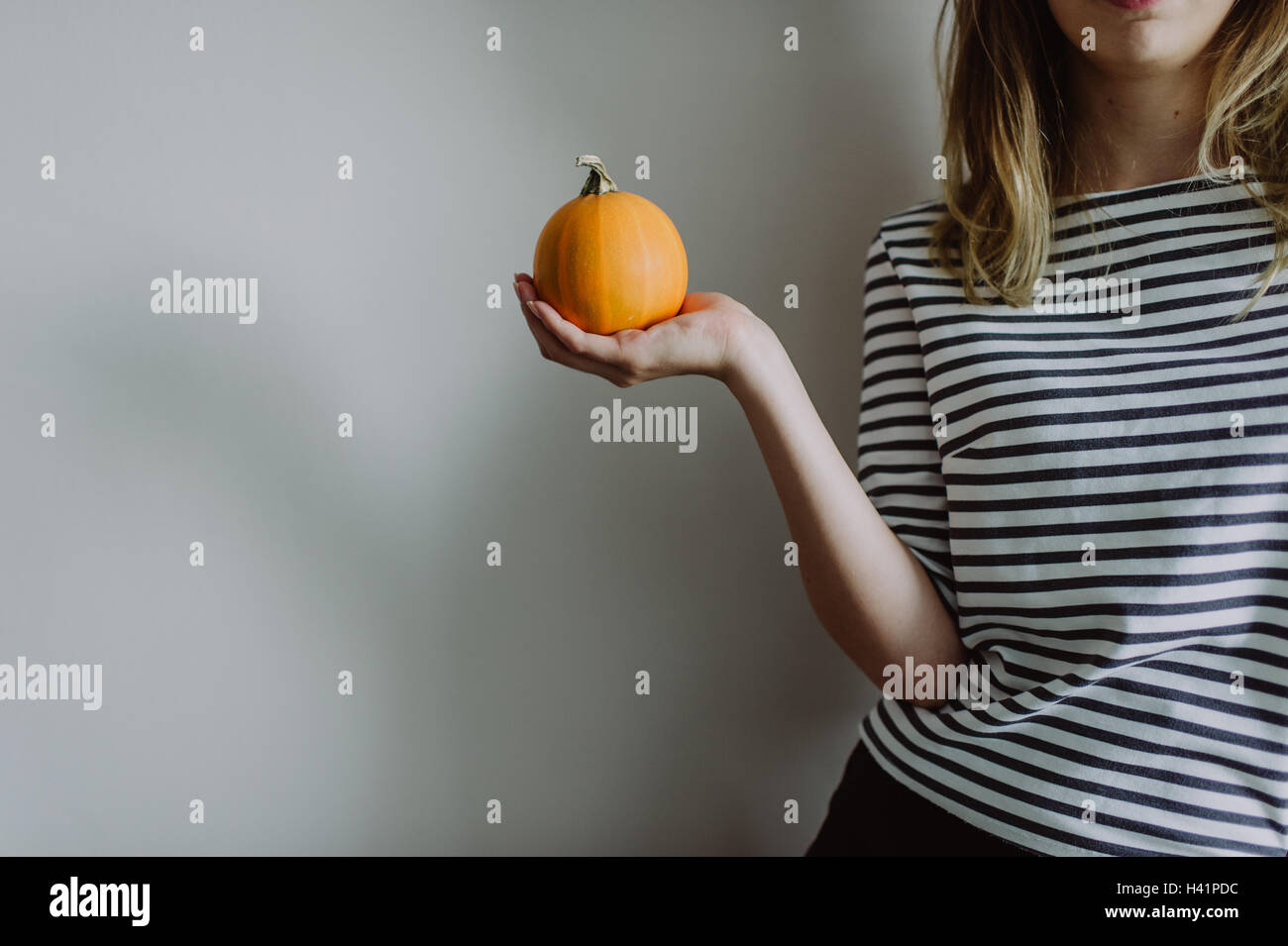 Halloween pumpkin in hand hi-res stock photography and images - Alamy