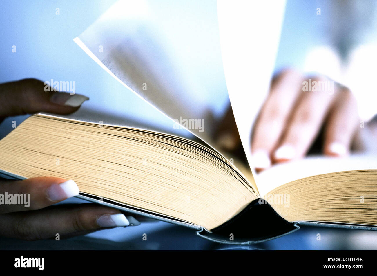 Turning pages in white book hi-res stock photography and images - Alamy