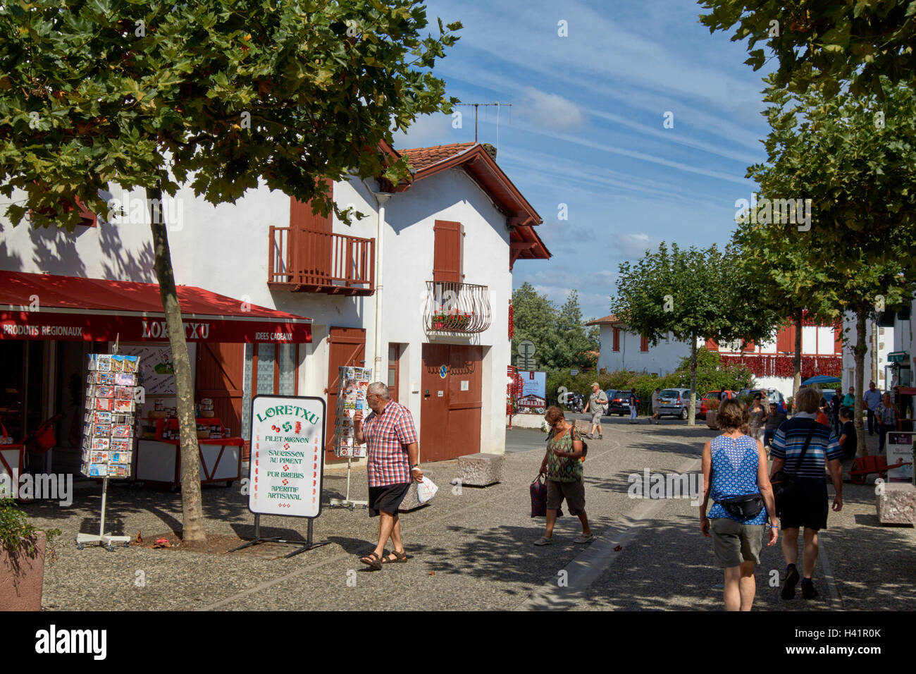 Tourist visiting the picturesque village of Espelette. Basque Country ...