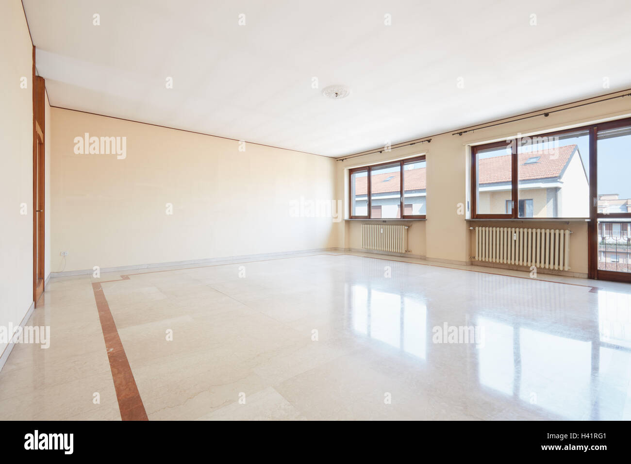 Empty living room with marble floor Stock Photo - Alamy