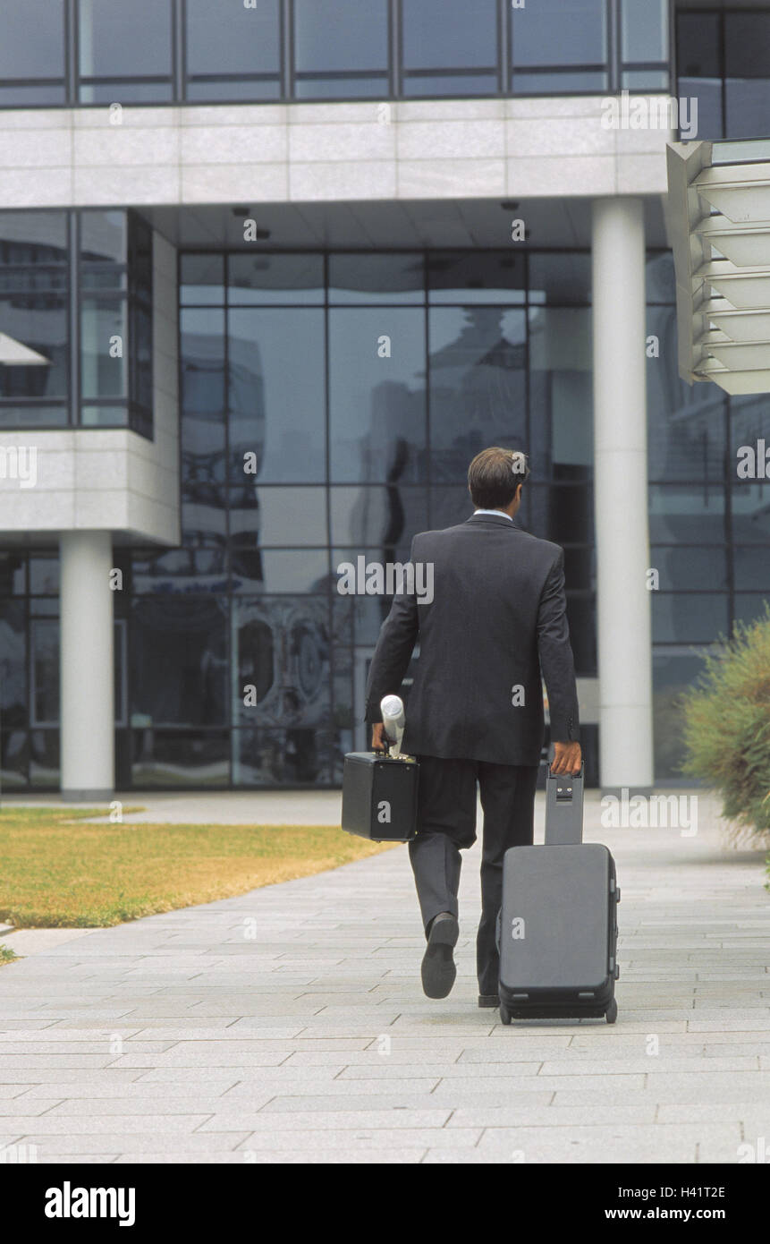 Businessman, briefcase, Trolley, back view, business premises ...