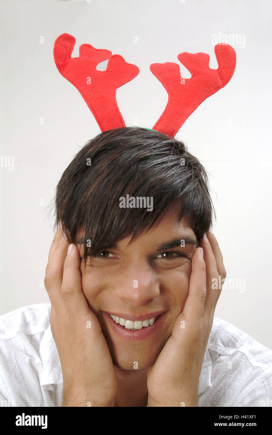 Man, young, happy, hair maturity, elk's antlers, head, rest on ...