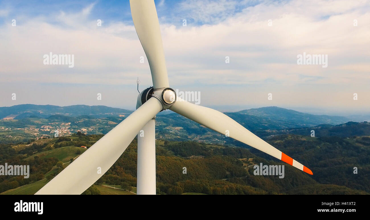 Single wind turbine on the green hill Stock Photo - Alamy