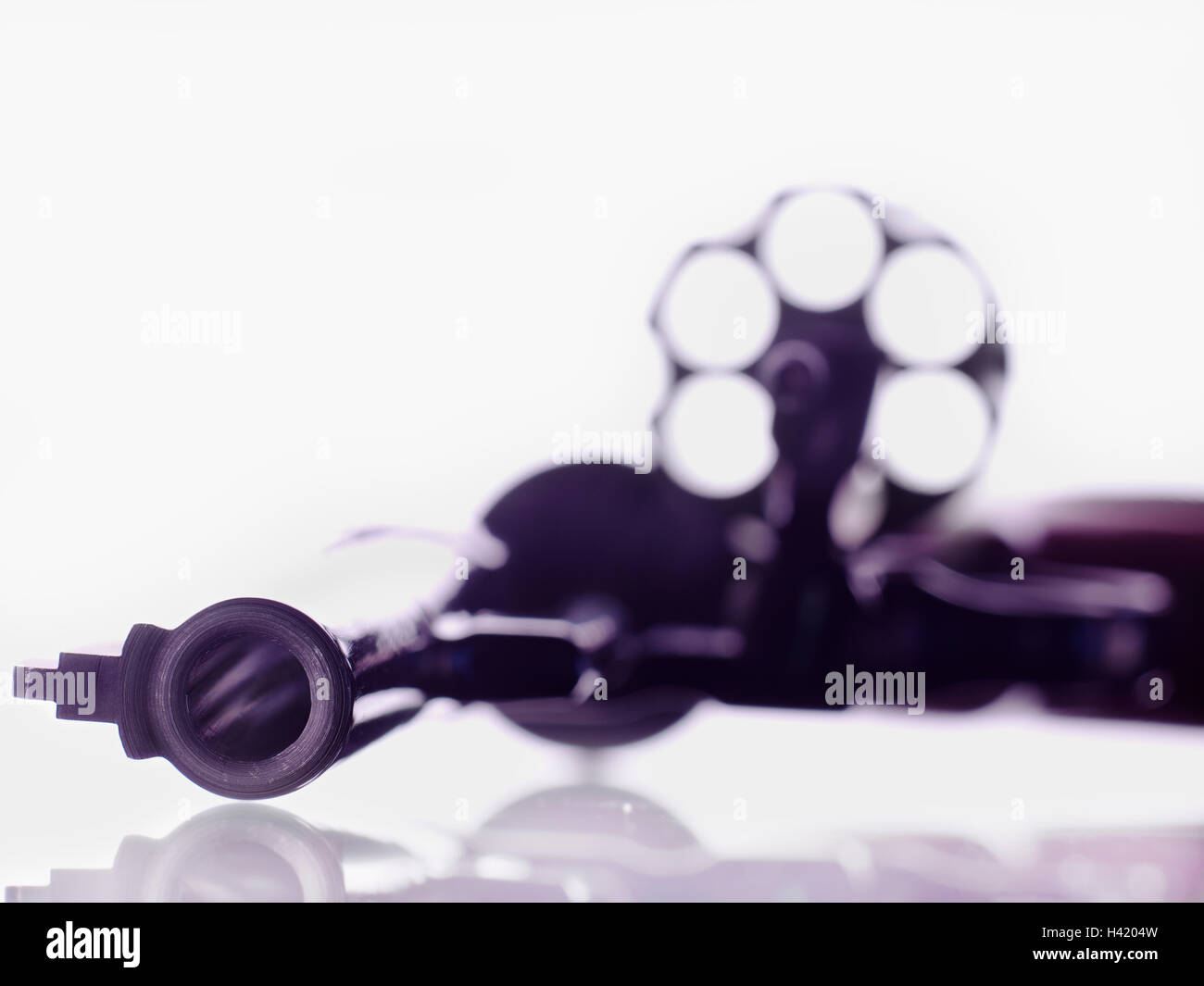Empty open revolver cylinder Stock Photo - Alamy