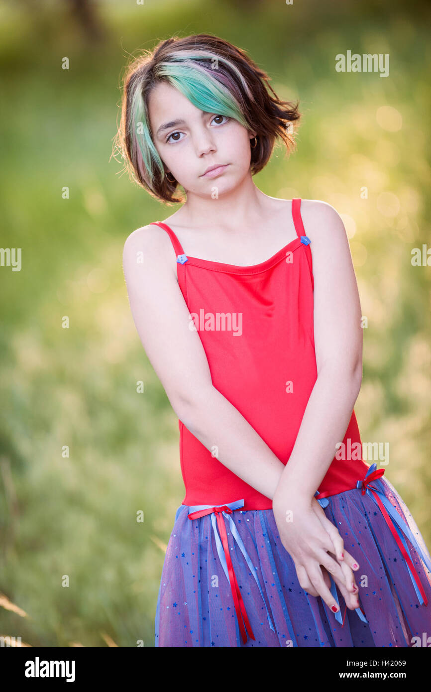 Serious Mixed Race girl with multicolor hair Stock Photo - Alamy