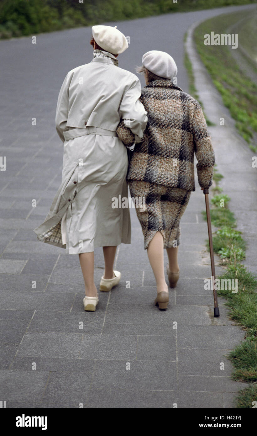 Bank promenade, seniors, arm in arm, walking floor, walk, back view ...