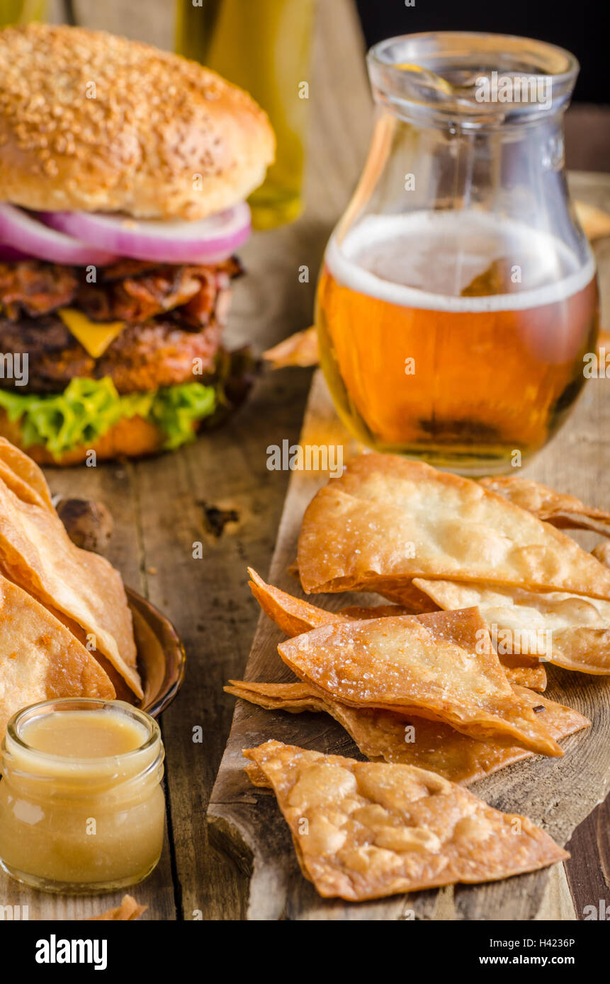 American rustic bacon burger with cheddar, beef, salad and vegetable ...
