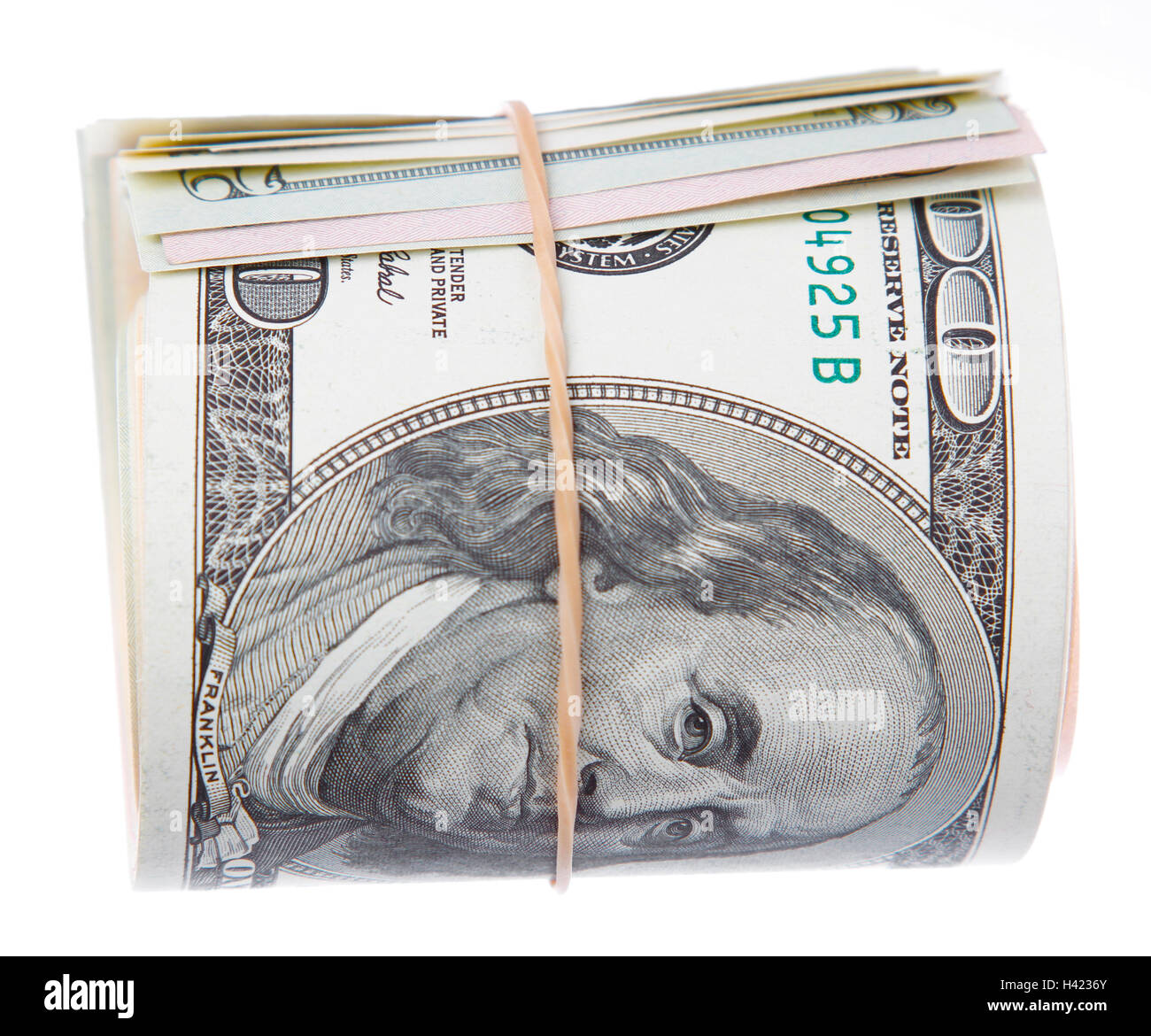 Roll of banknotes on plain background Stock Photo - Alamy